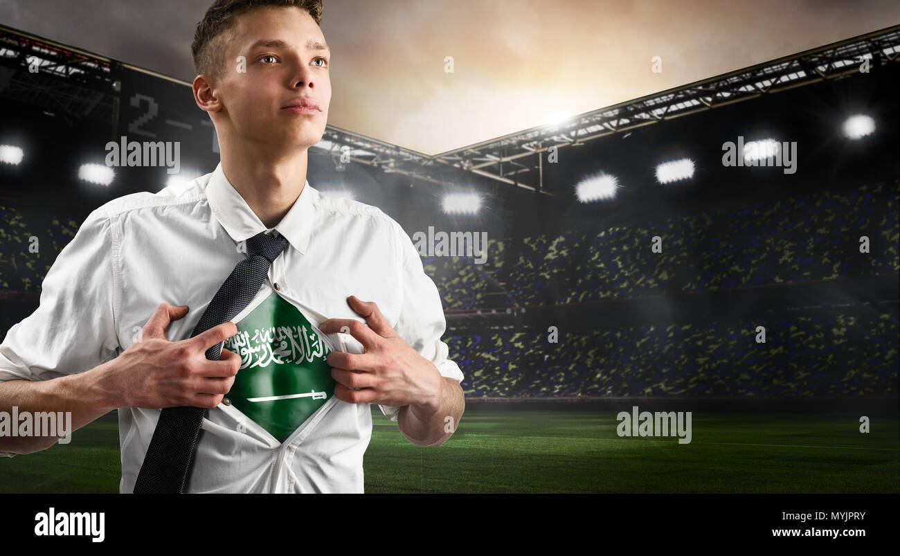 Saudi Arabia soccer or football supporter showing flag Stock Photo - Alamy