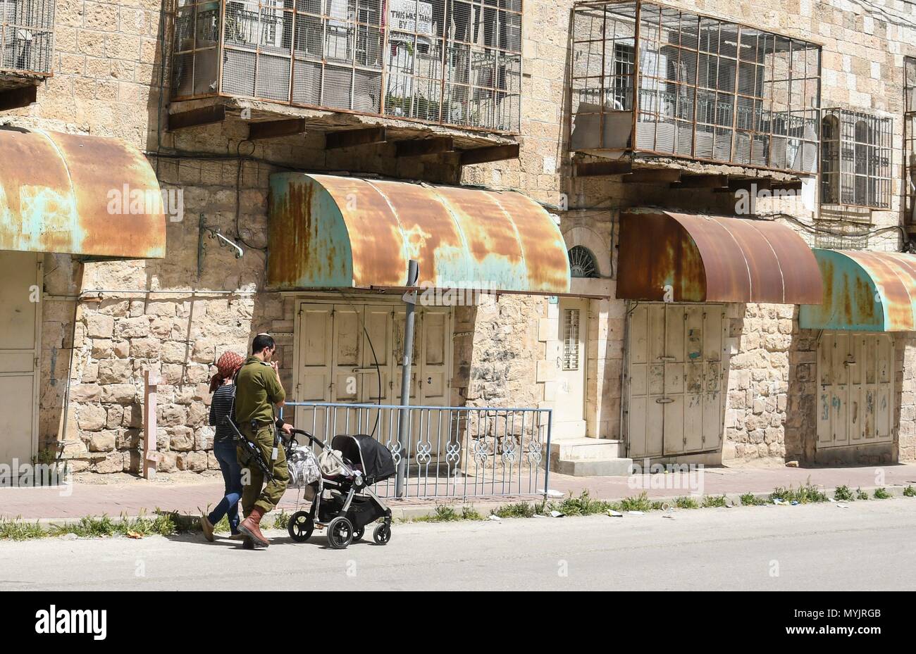Israeli soldier with gun and buggy , Hebron, April 4, 2018 | usage ...