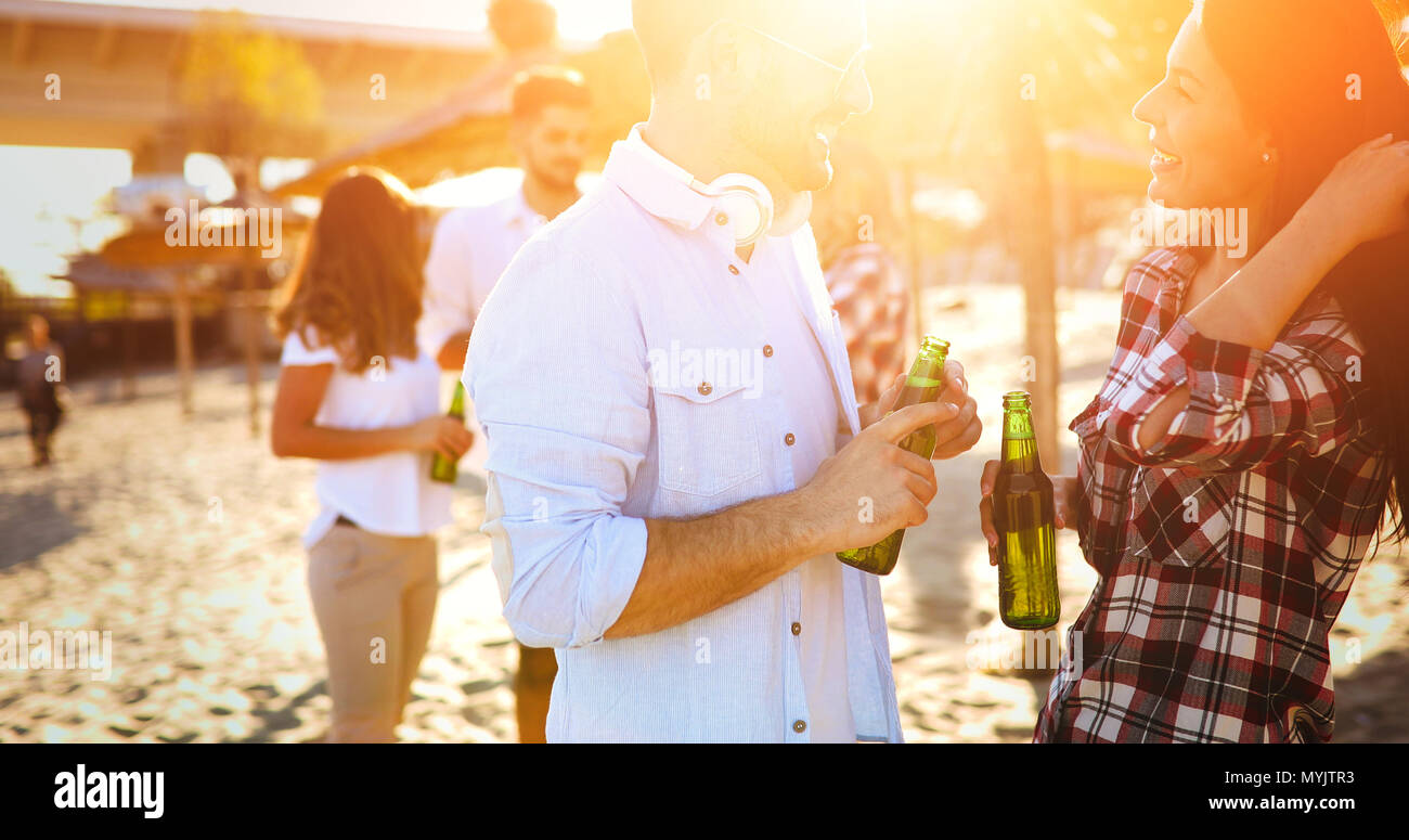 Friends partying and having fun on beach at summer Stock Photo - Alamy