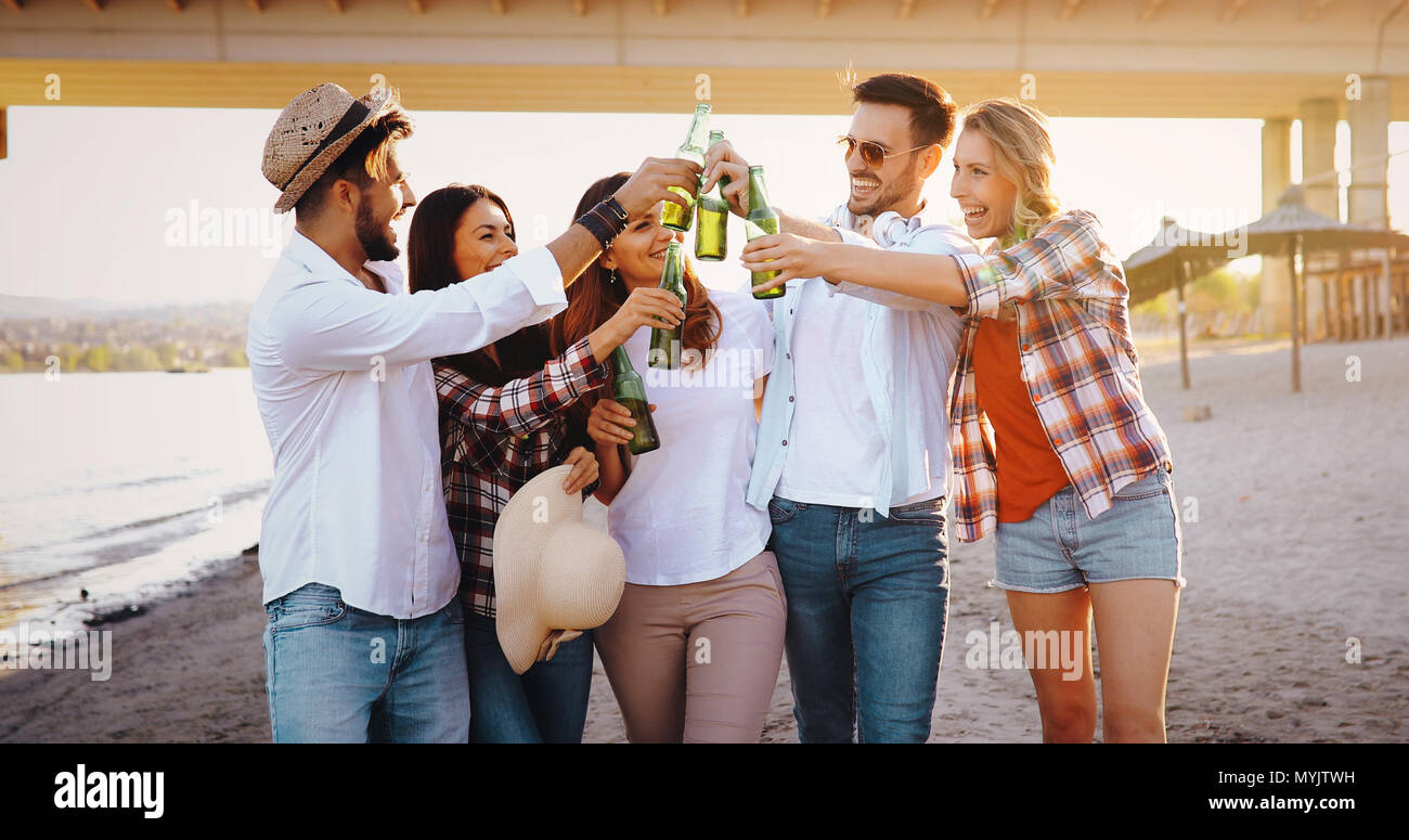 Happy friends laughing and smiling outdoors Stock Photo - Alamy