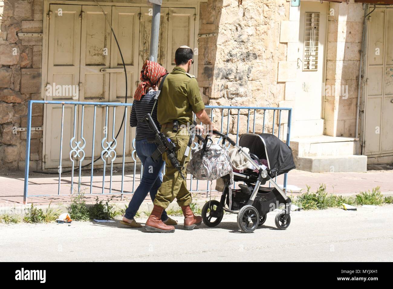 Israeli soldier with gun and buggy , Hebron, April 4, 2018 | usage ...