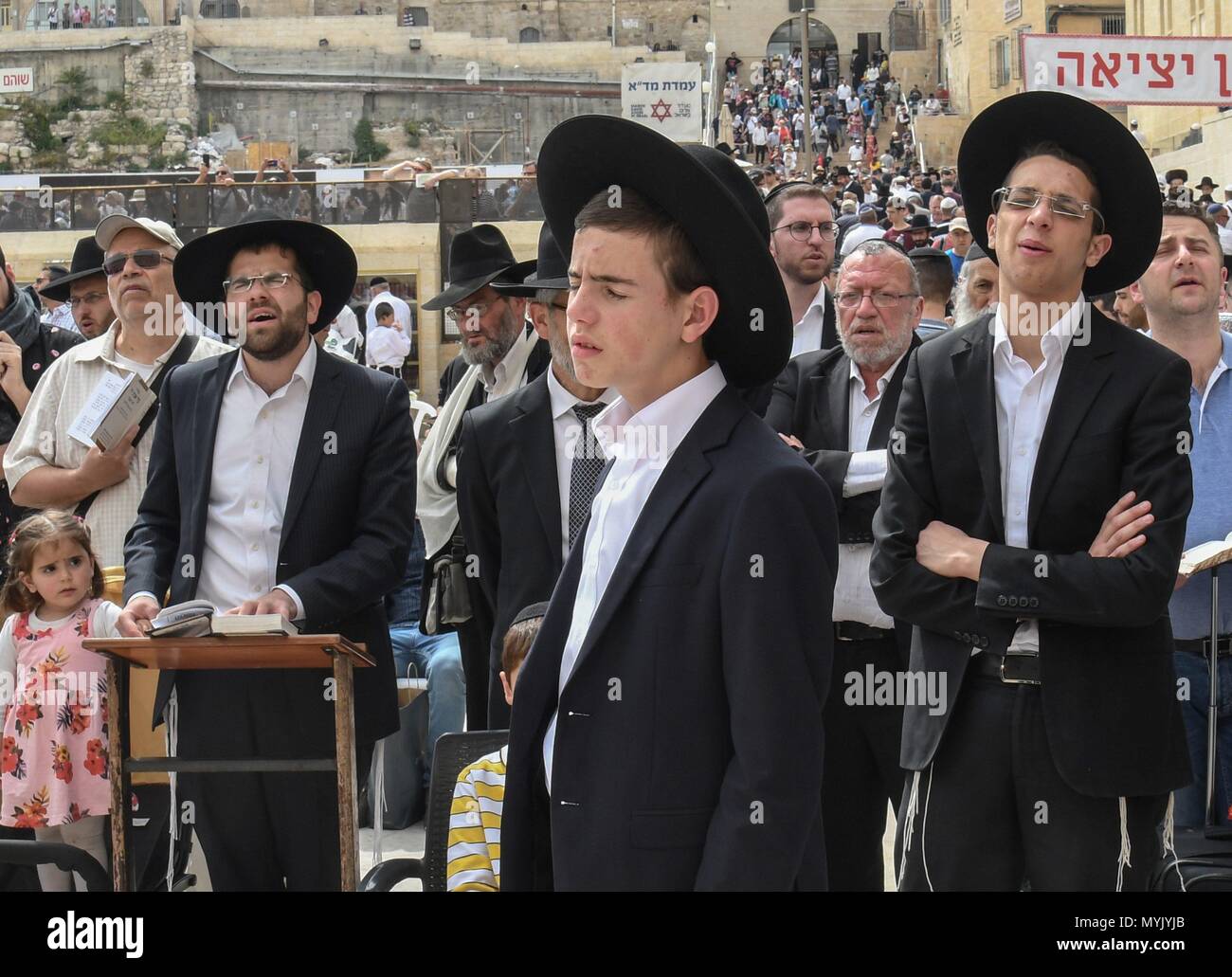 Jews gathering and praying at the Western Wall inside the Old City in ...