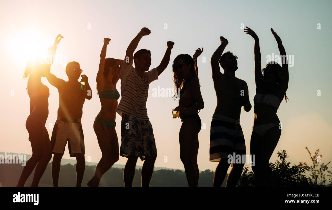 Friends partying during summer vacation Stock Photo - Alamy