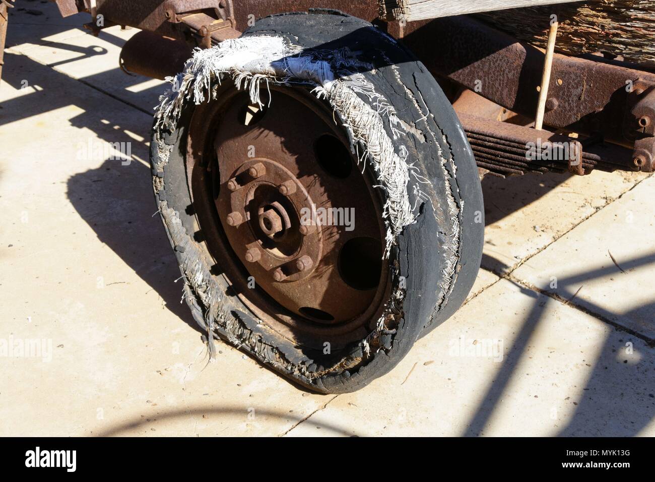 Old worn rag car (tyre) tire, on rusty wheel, Western Australia April ...