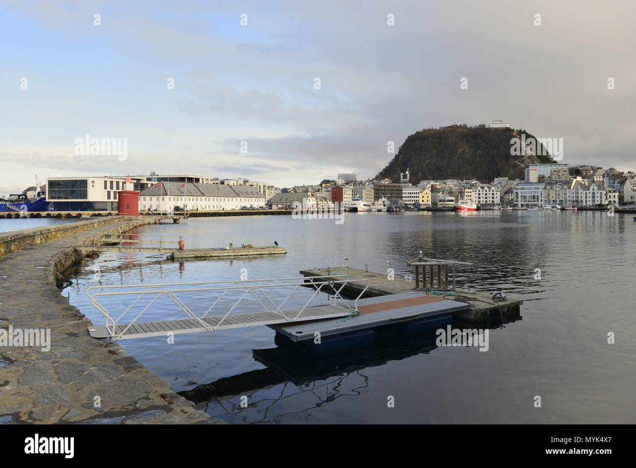 Harbour mole with boat bridges and the buildings around Ålesund's ...