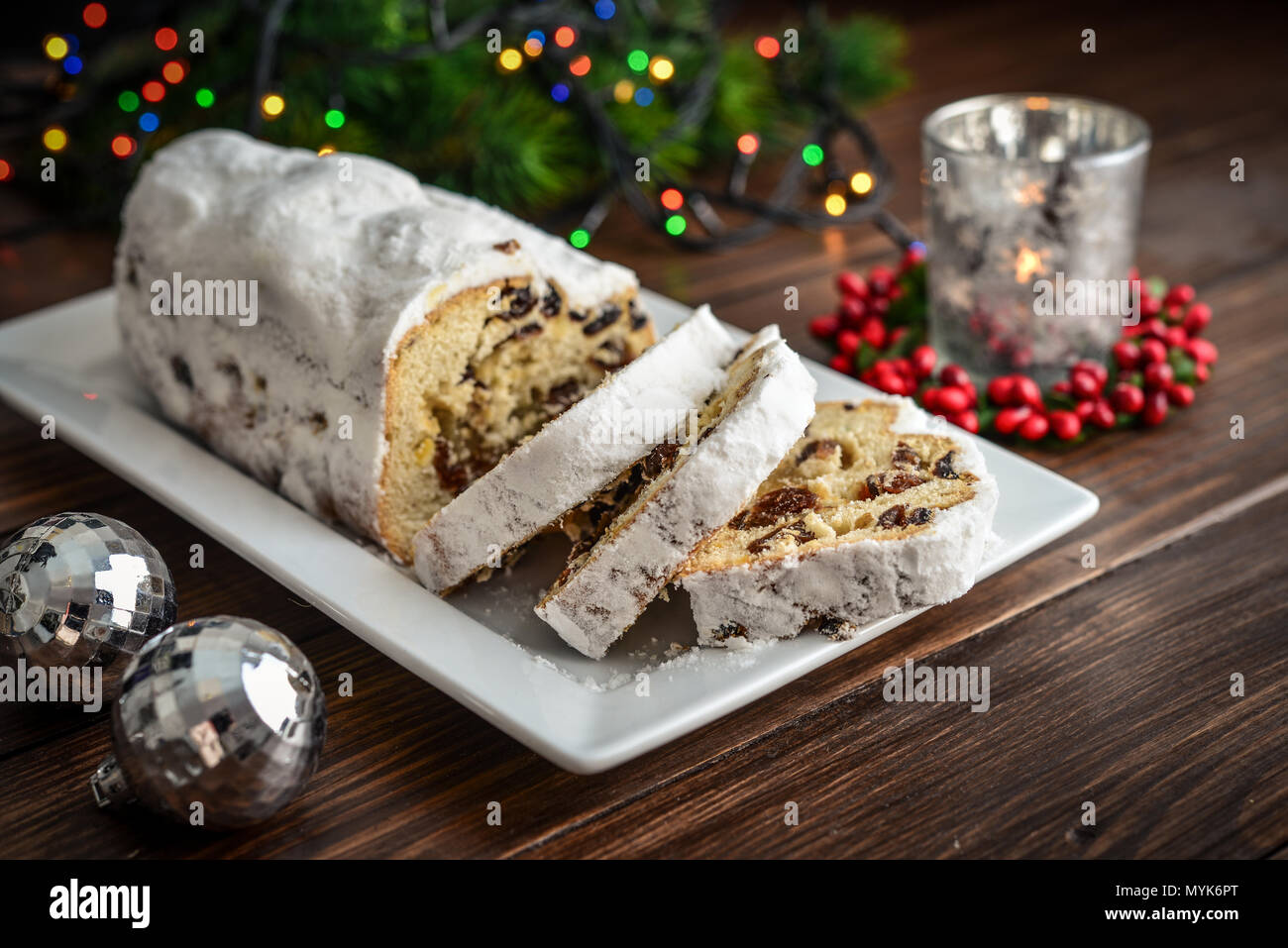 Christmas stollen. Traditional sweet fruit loaf with icing sugar on ...