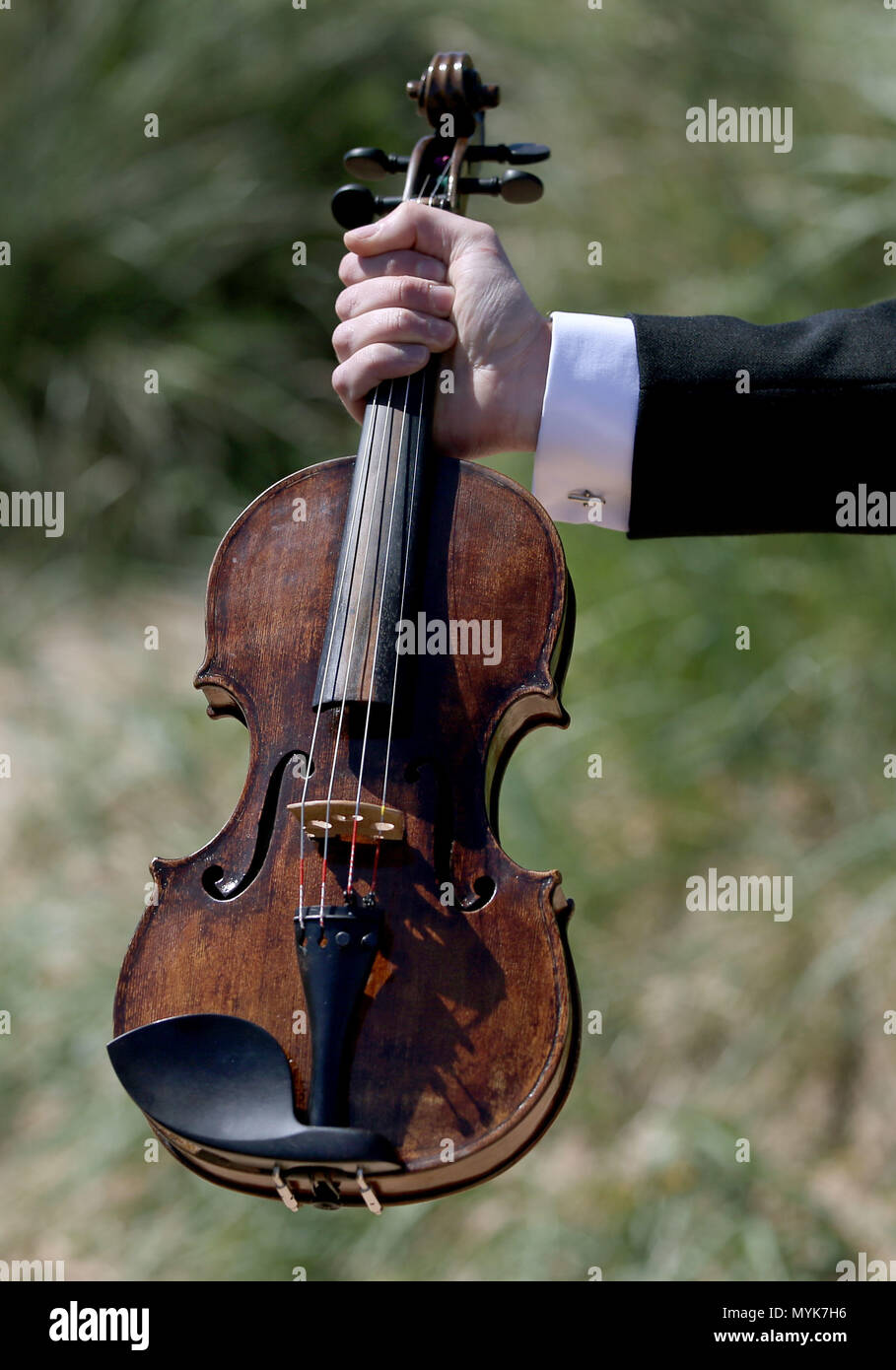 Musician Thoren Ferguson with the Il Mare Violin, which is made from ...