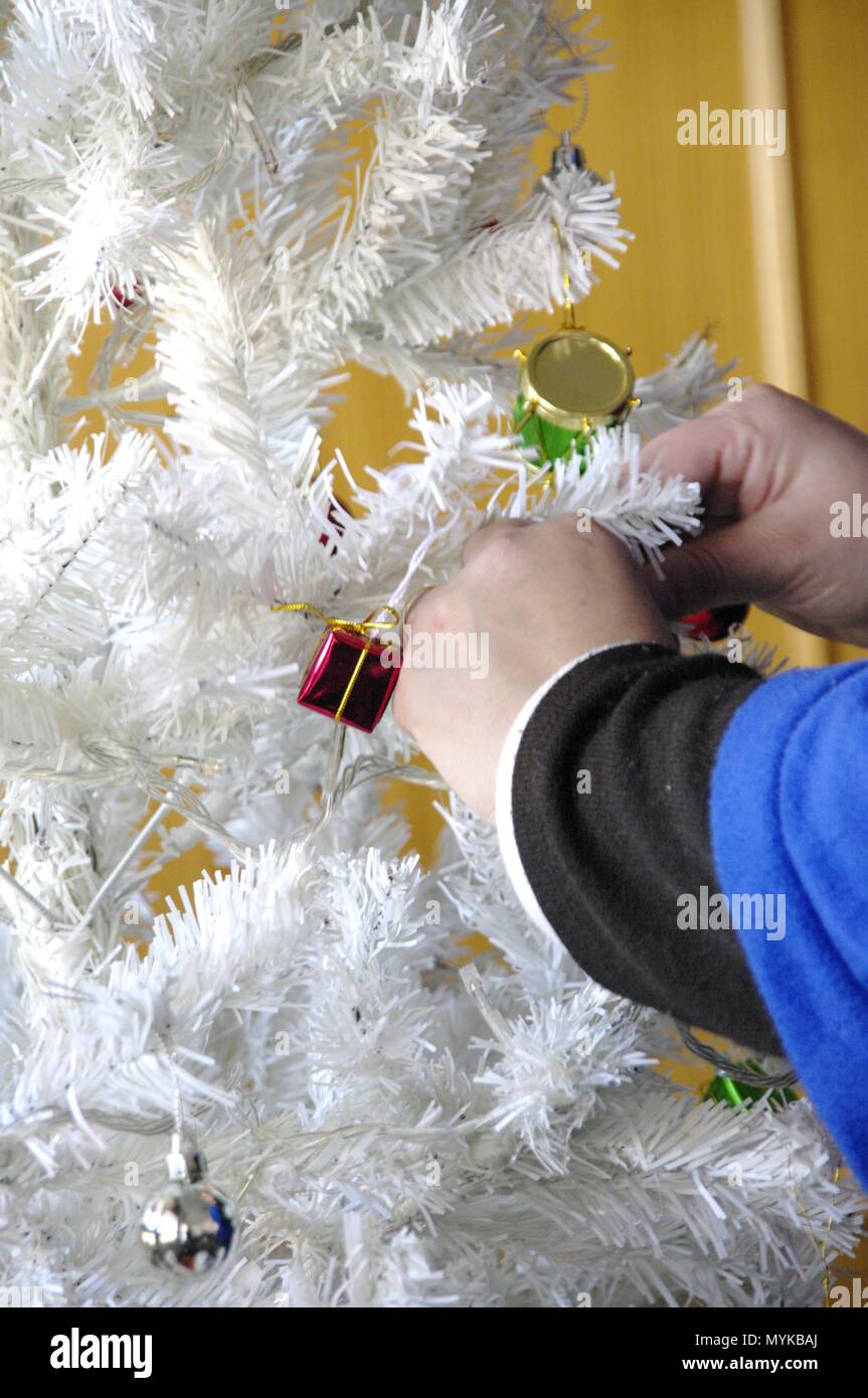 Womans hand decorating xmas tree hi-res stock photography and images ...