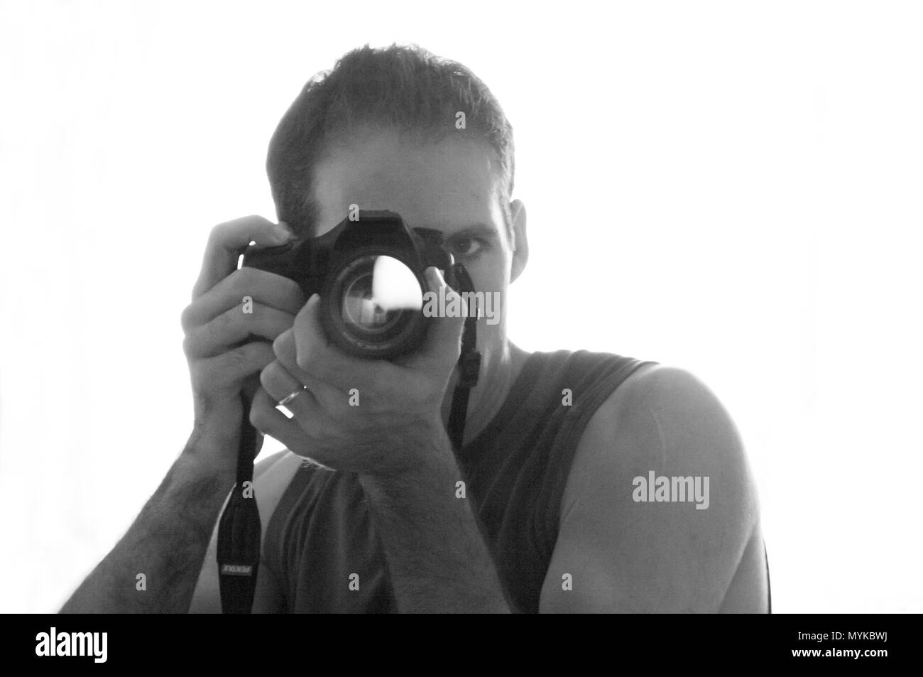 Portrait of a photographer with his camera in full action Stock Photo ...