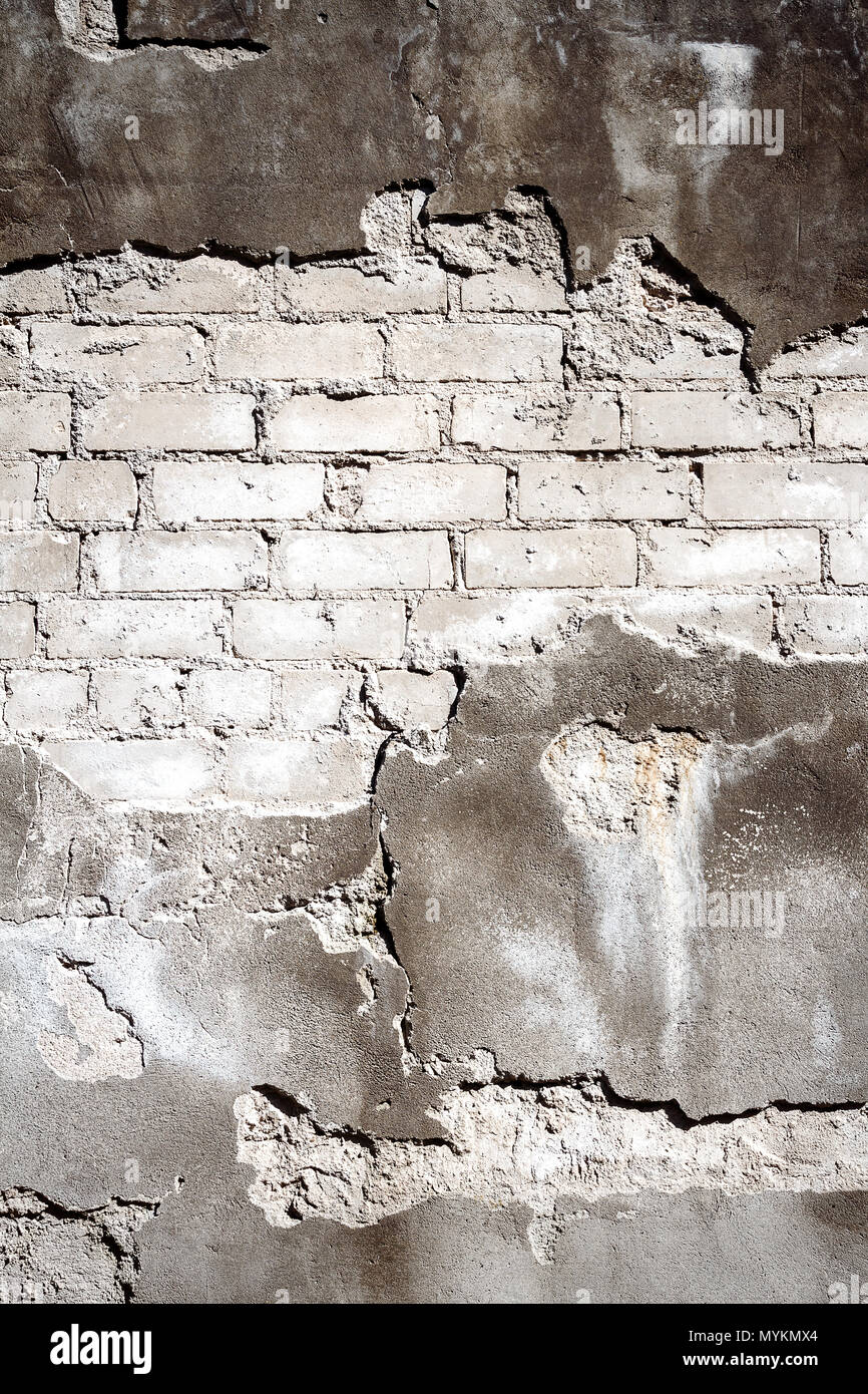 Old gray brick and plaster wall texture background. Painted distressed ...