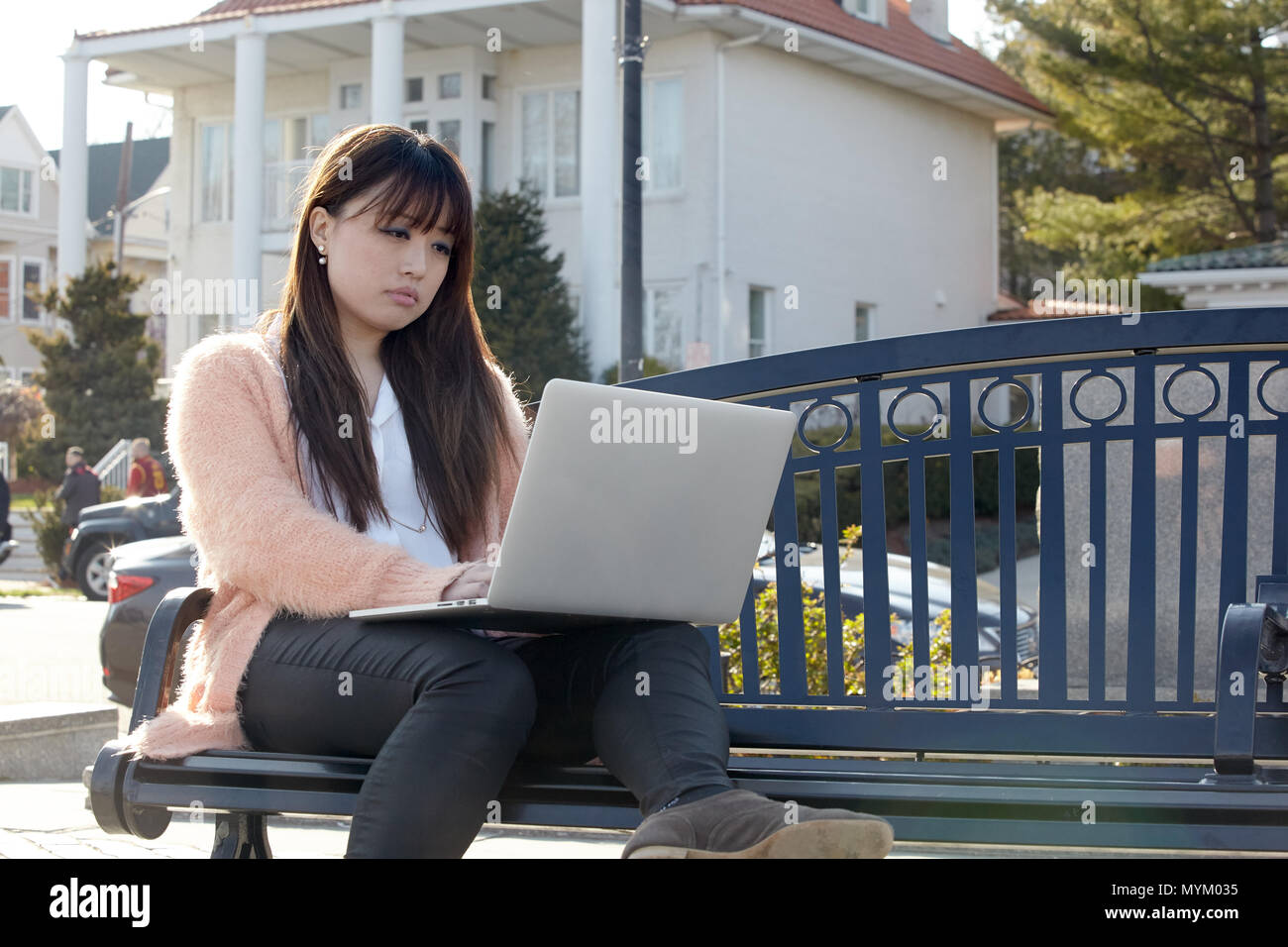 Using the laptop sitting outside the house hi-res stock photography and ...