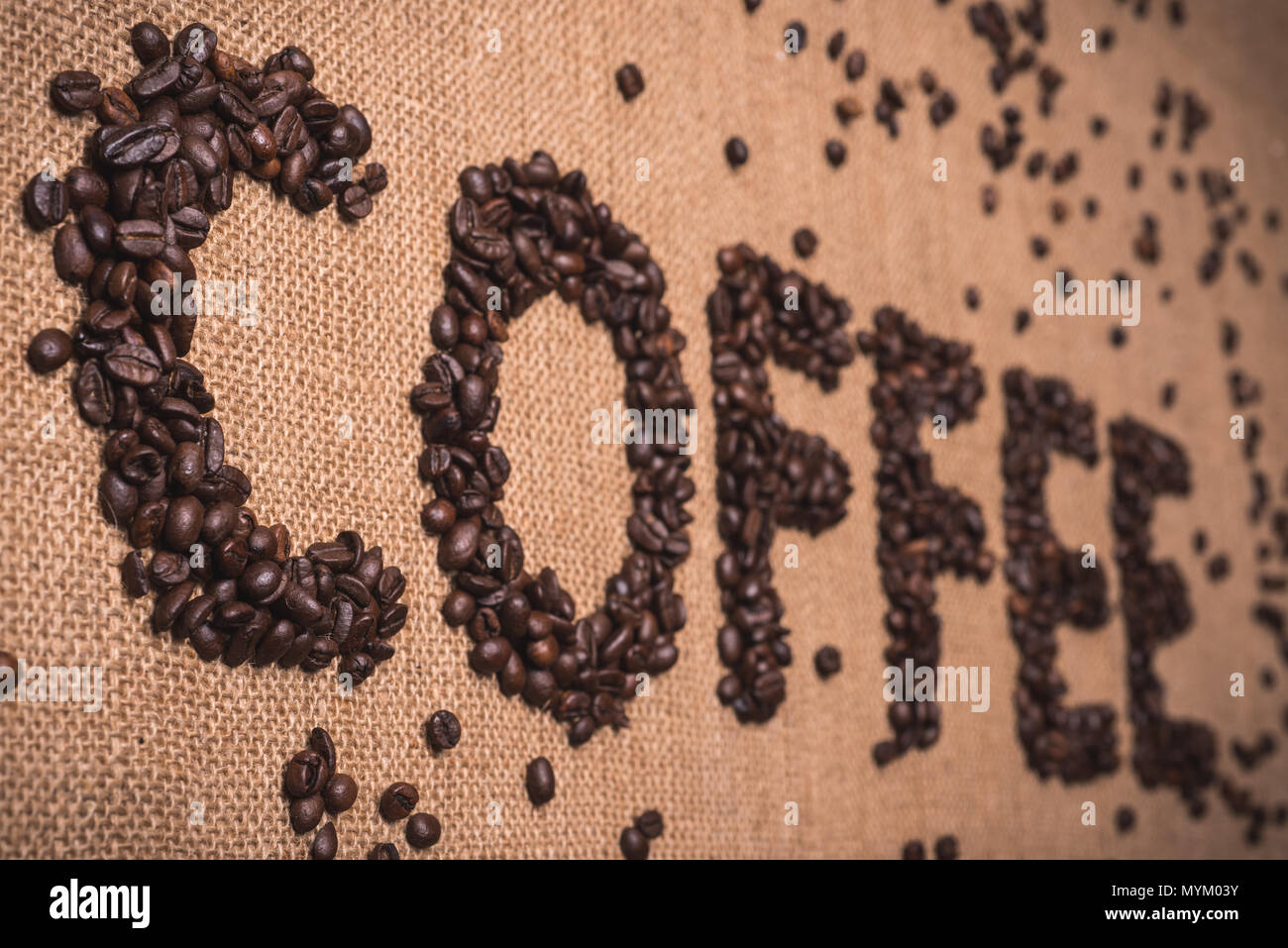 coffee word written with toasted coffee beans on top view composition ...