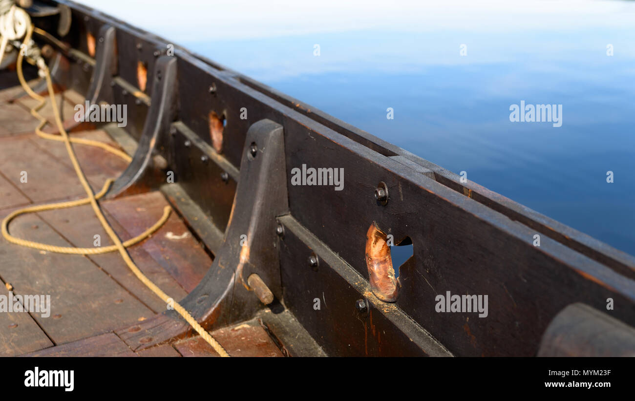 Leather clad oar hole on a wooden Viking ship replica Stock Photo - Alamy
