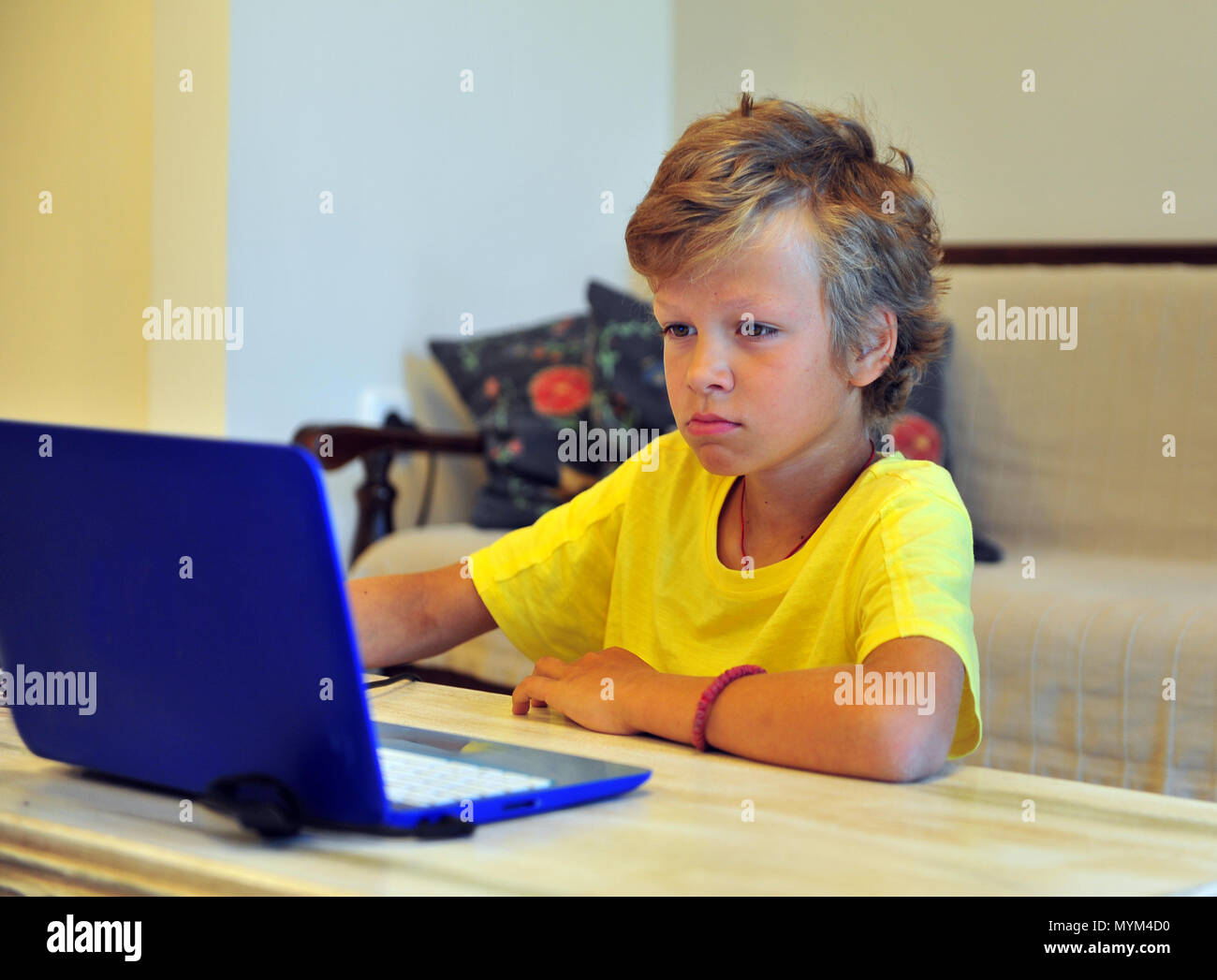 Portrait of a kid using computer Stock Photo - Alamy