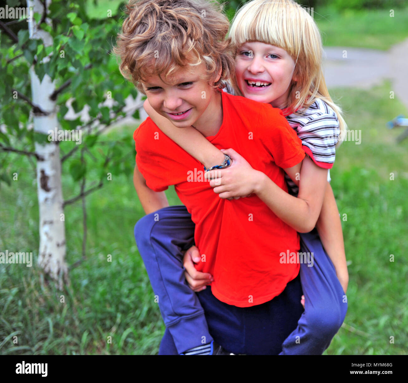 Two brothers having fun in the forest Stock Photo - Alamy