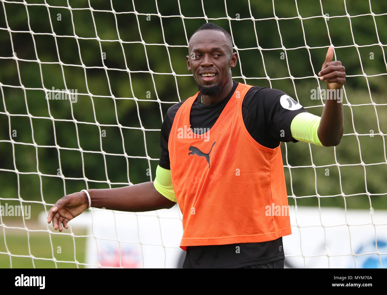 Usain Bolt reacts during the World XI team's training session for ...