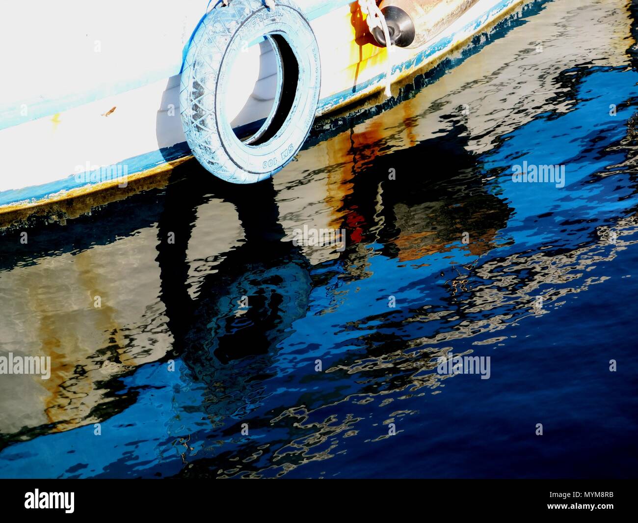 Reflection of a boat on water Stock Photo - Alamy