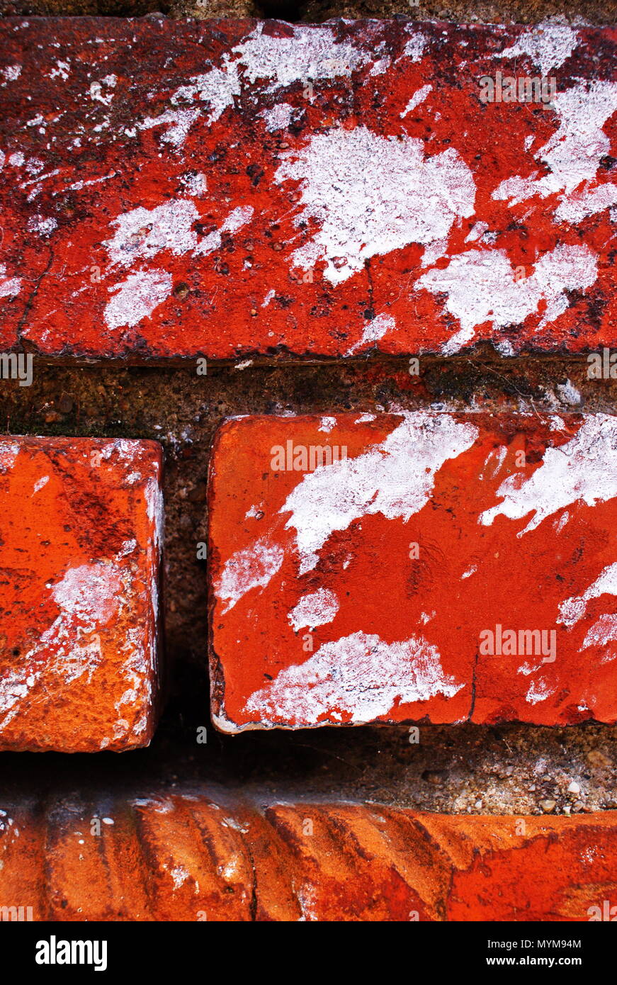 Brick wall detail with splash of white paint Stock Photo - Alamy