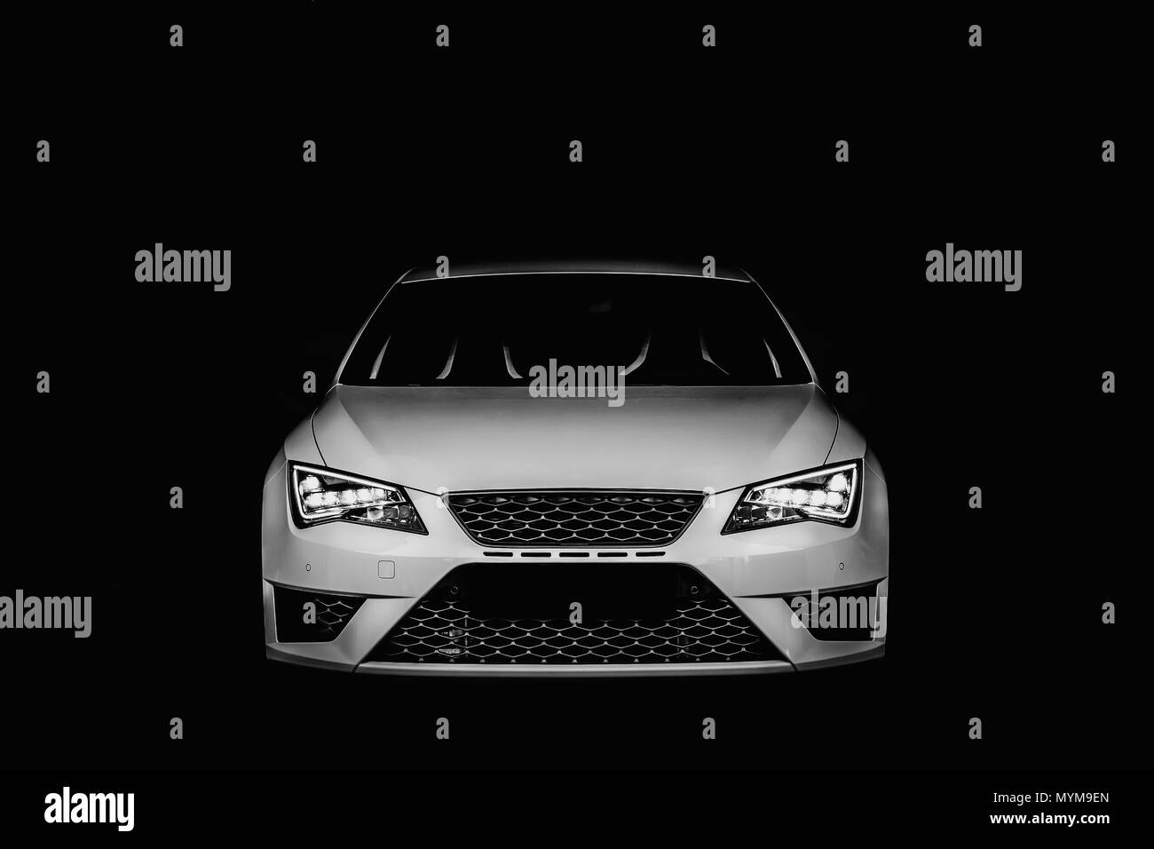 White car front view Isolated against black backdrop Stock Photo - Alamy