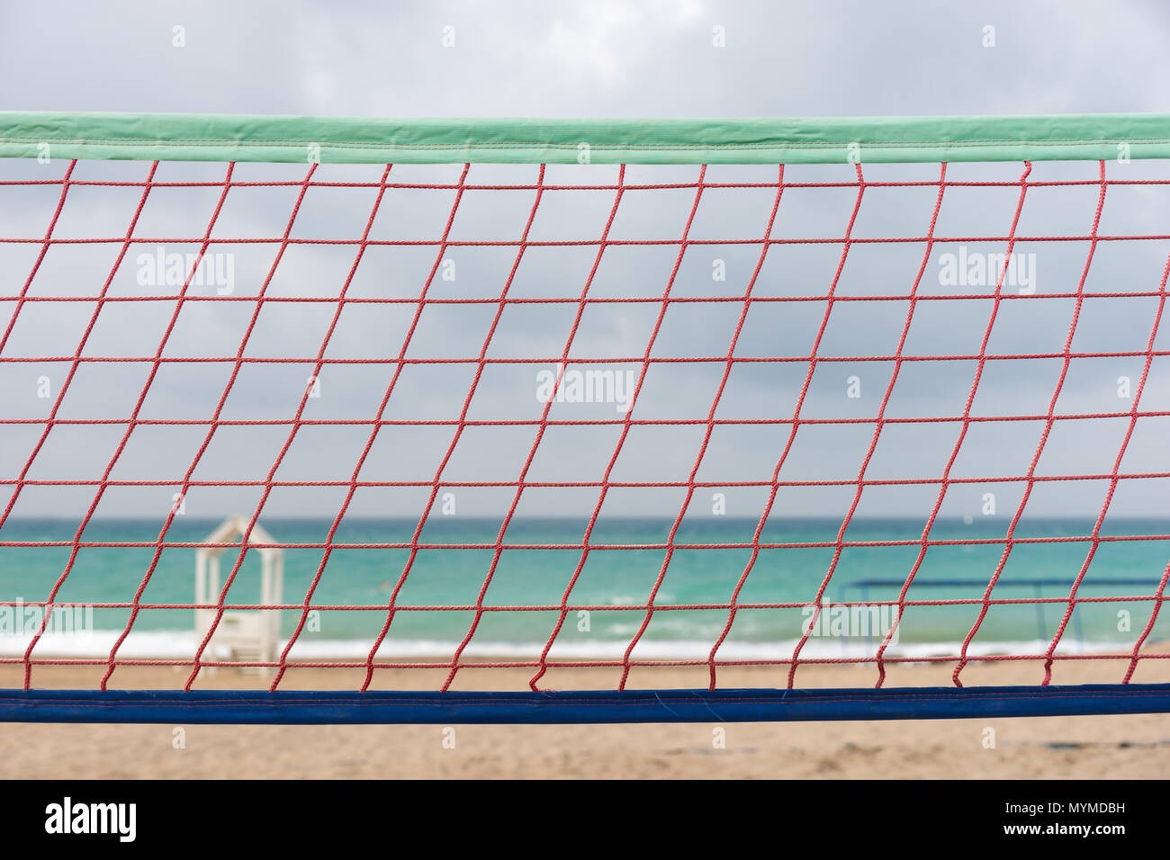 Volley ball net on a deserted tropical beach in a close up detailed ...