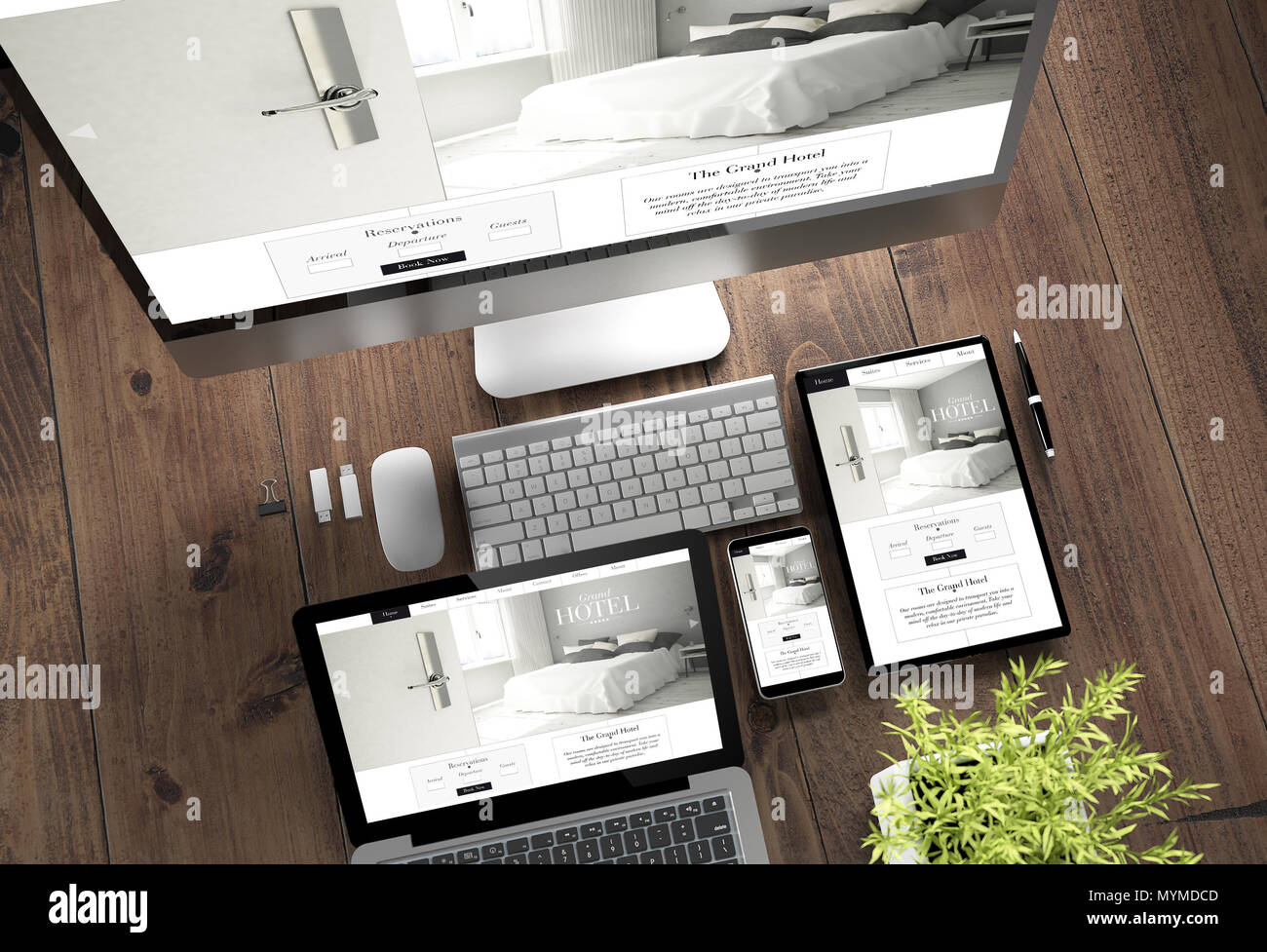 3d rendering top view of devices with grand hotel on screen on wooden ...