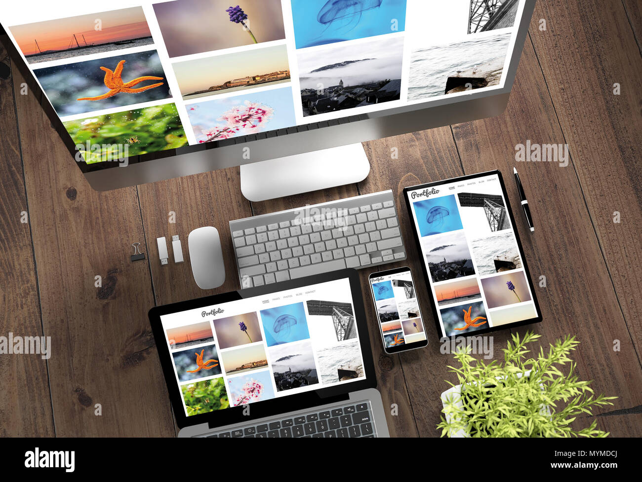 3d rendering top view of devices with portfolio on screen on wooden desktop Stock Photo - Alamy