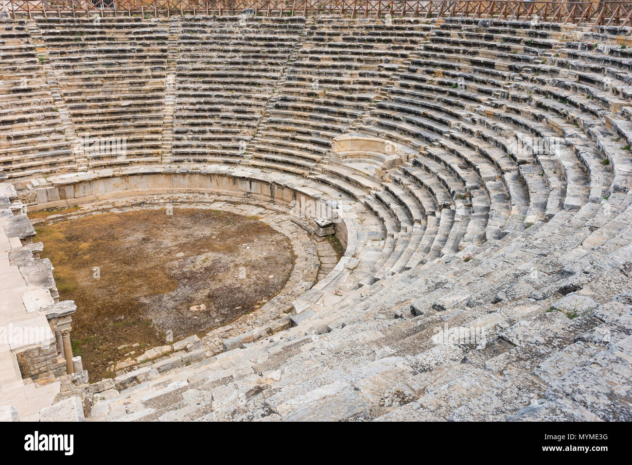 Circular stone seating in a well preserved Greek amphitheatre viewed ...
