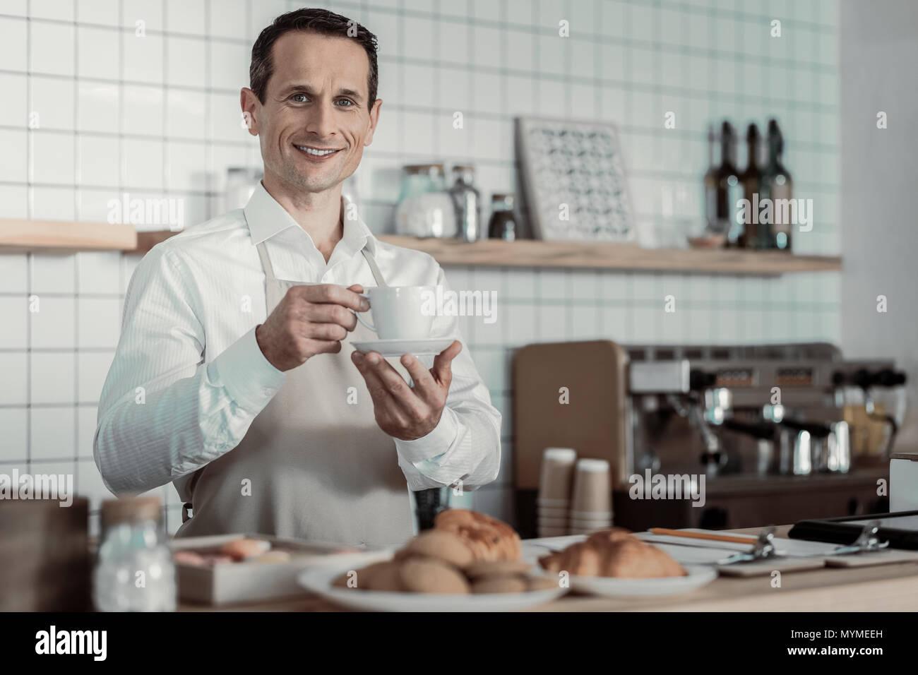Pleased male person looking for new clients Stock Photo - Alamy