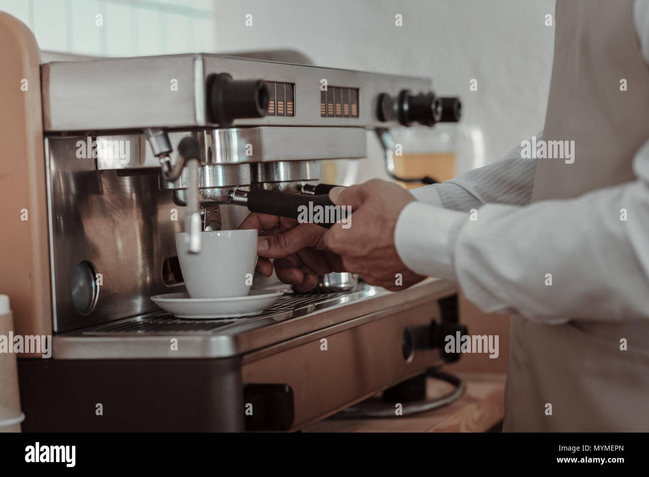 Close up of male hands that using coffee-engine Stock Photo - Alamy