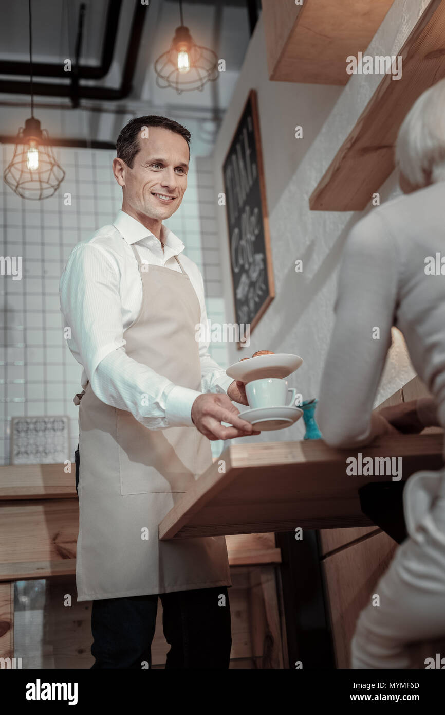 Handsome waiter communicating with his client Stock Photo - Alamy