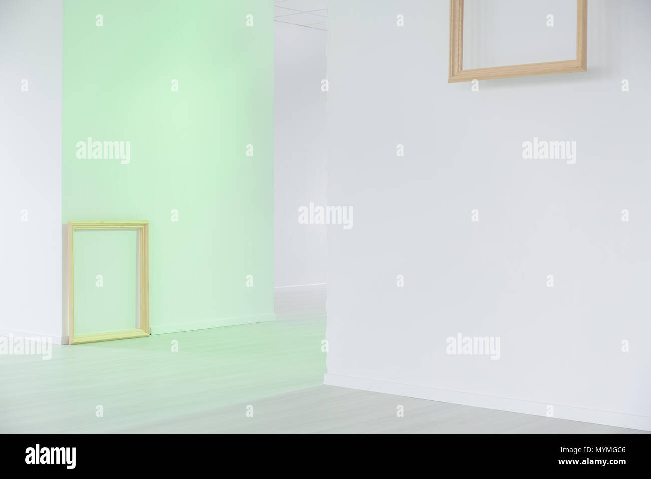 Interior in white and mint green with two frames hanging on walls Stock ...