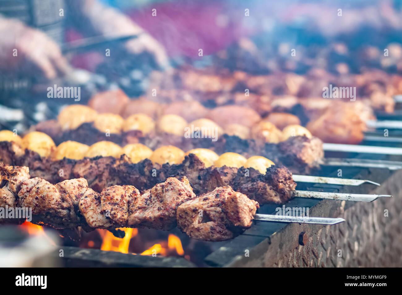 Tasty shish kebab cooking process. Grilled meat Stock Photo - Alamy