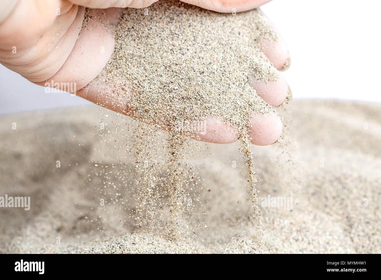 Sand flowing through hands hi-res stock photography and images - Alamy