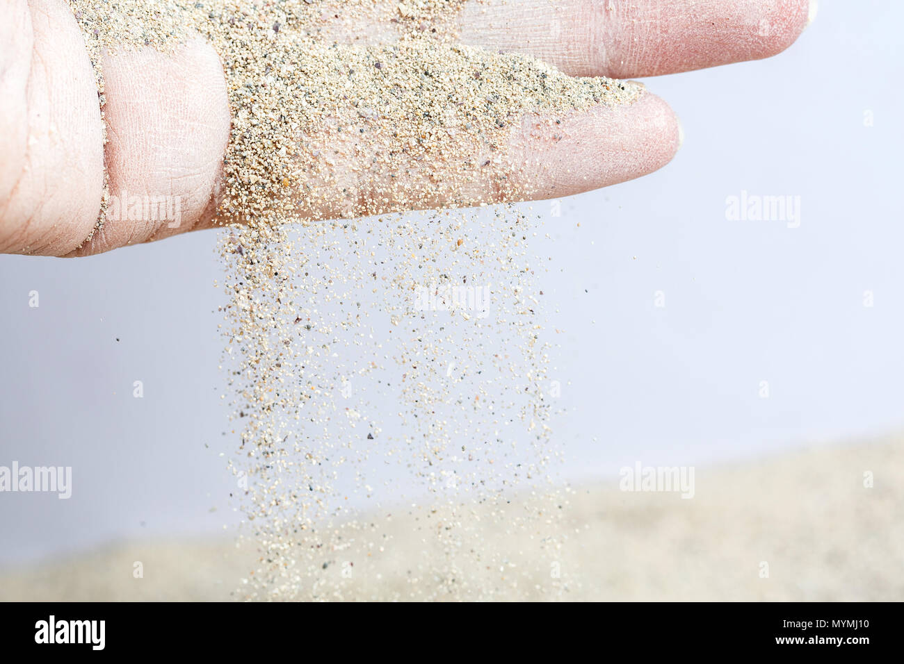 Sand flowing through hands hi-res stock photography and images - Alamy