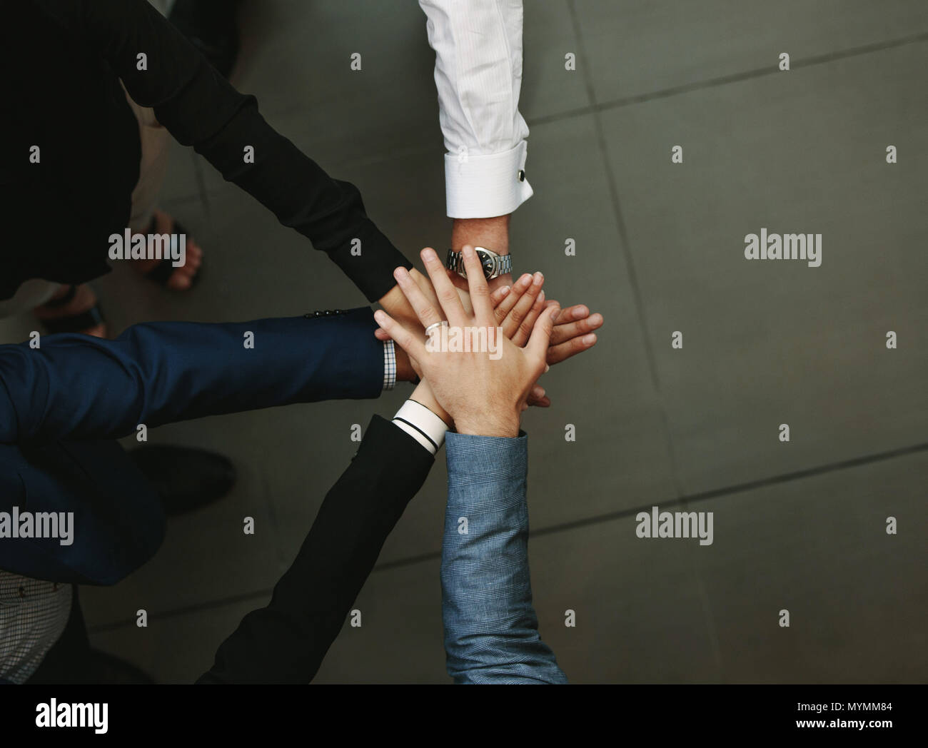 Top view of business people putting their hands together. Stack of ...