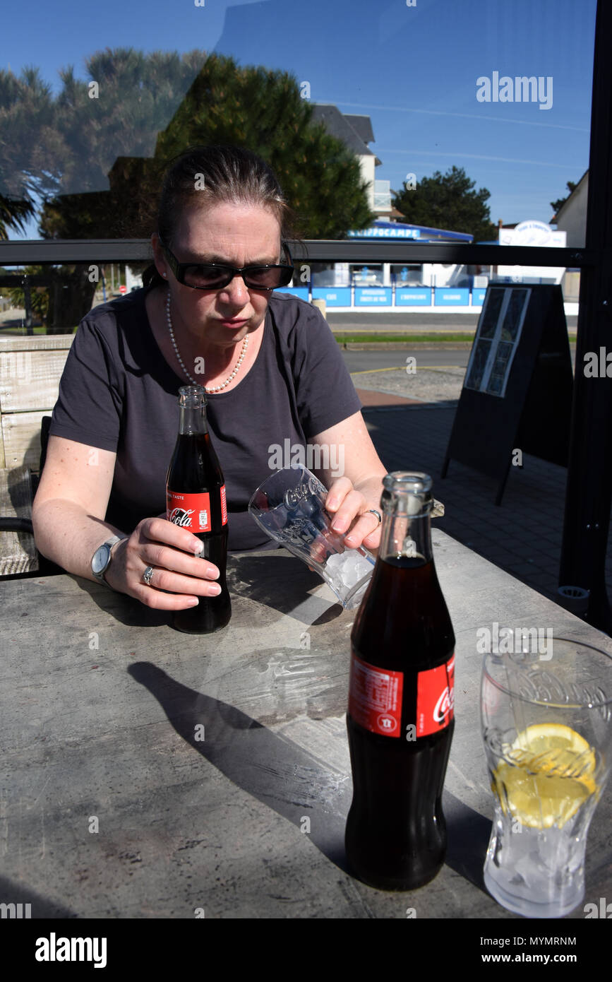Coca cola woman drinking bottle hi-res stock photography and images - Alamy