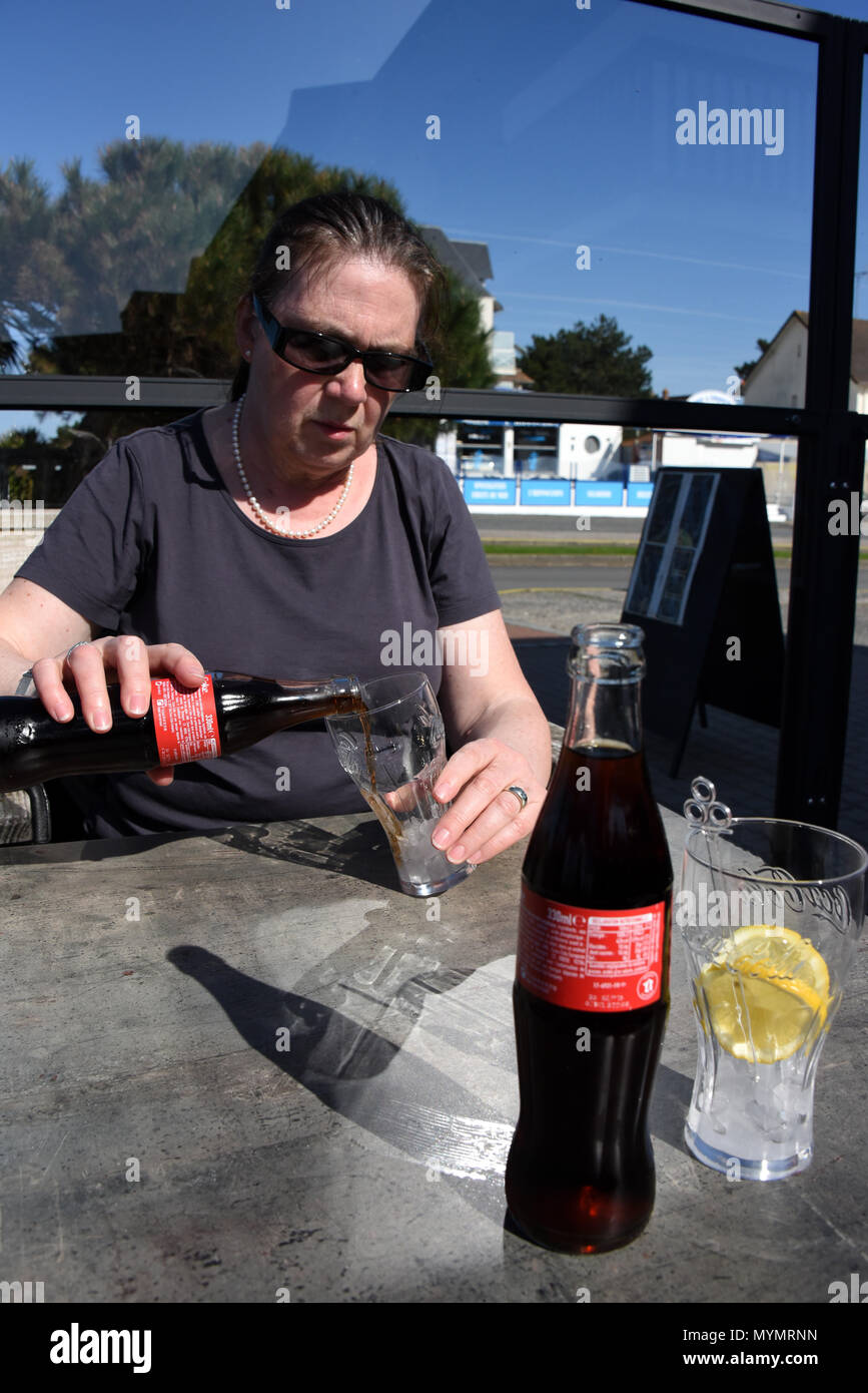 Woman drinking coca cola hi-res stock photography and images - Alamy