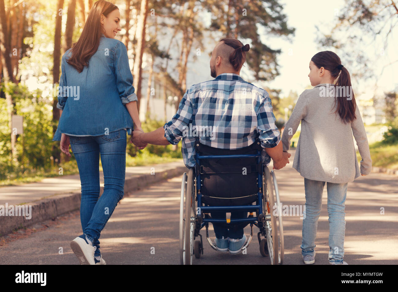 Positive happy family having a walk together Stock Photo - Alamy