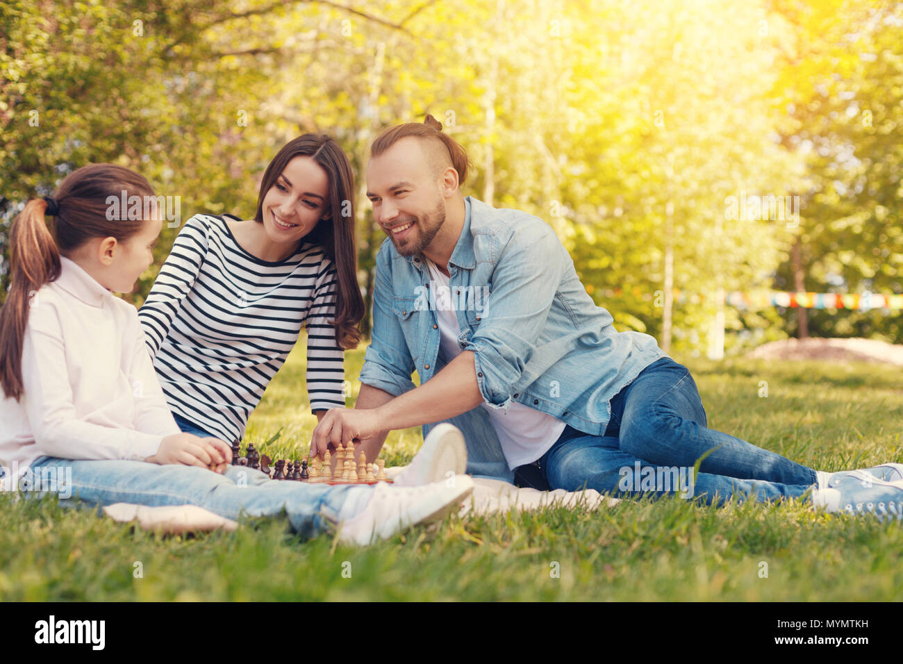 Happy cheerful man playing chess Stock Photo - Alamy