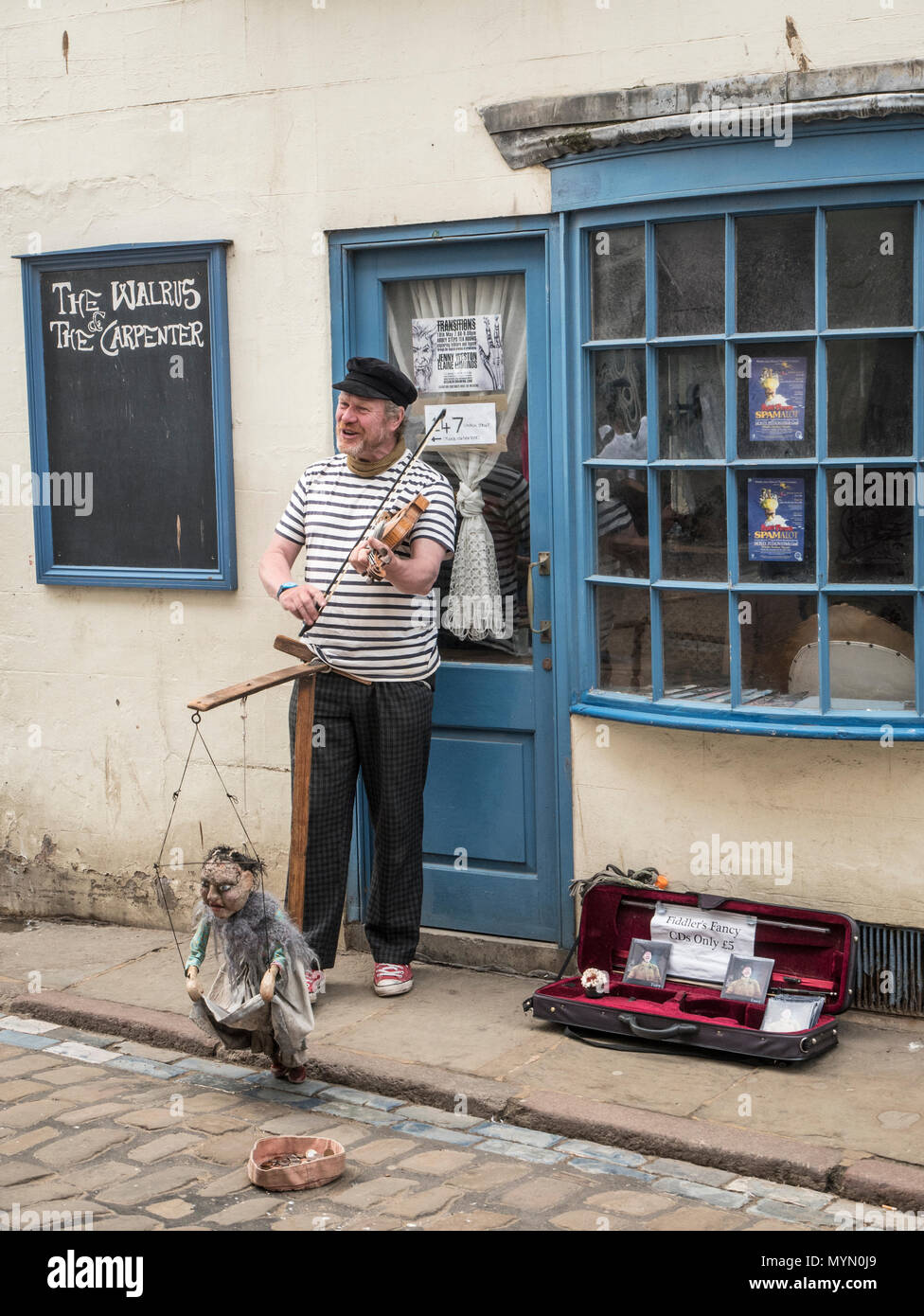 Fiddler and puppet Street entertainer in Whitby Stock Photo - Alamy