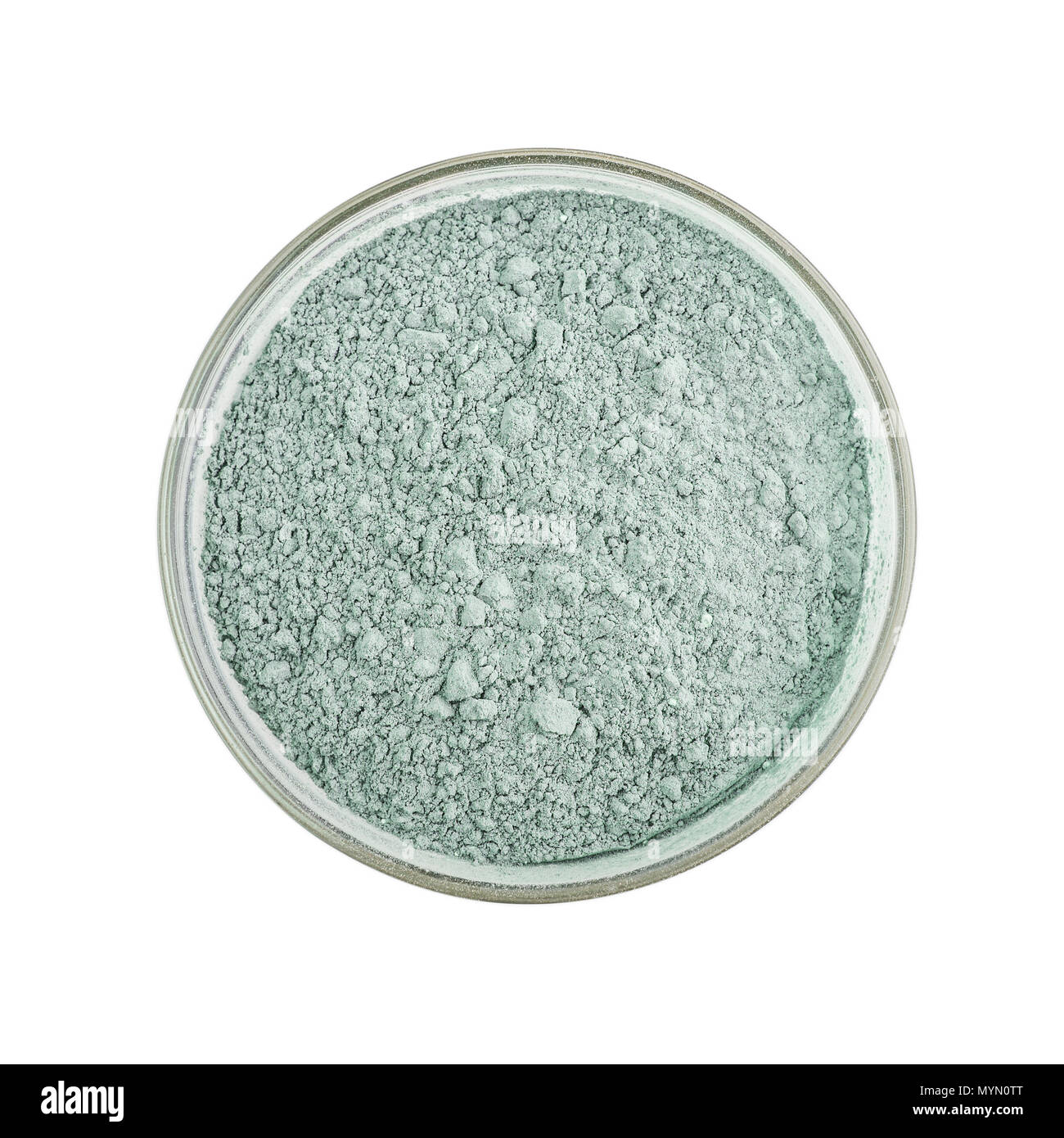 Blue cosmetic clay powder in glass bowl isolated on white background ...