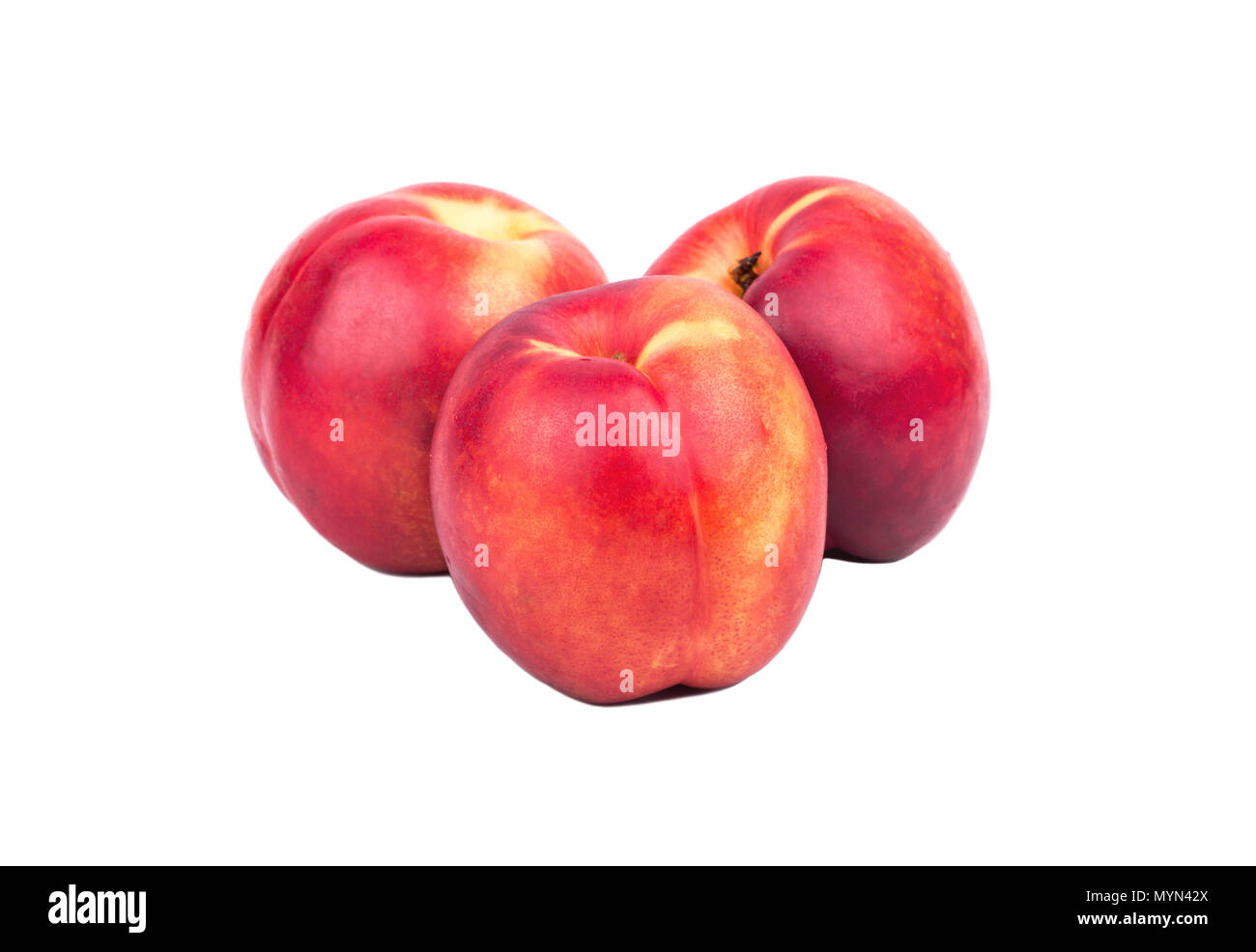 Three fresh nectarines fruit on a white background Stock Photo - Alamy