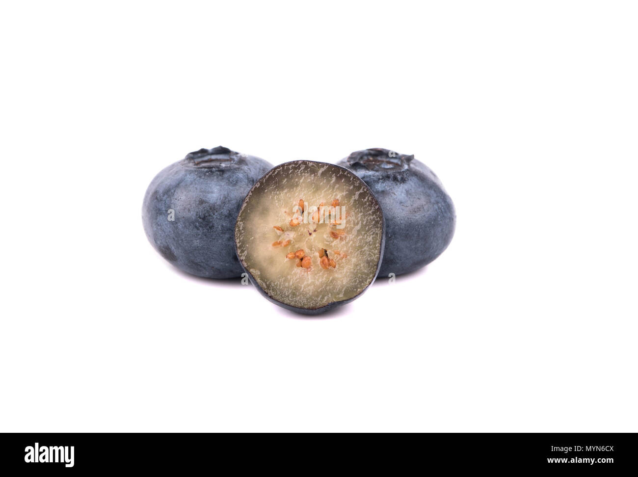 Three fresh blueberries with the cut half on a white background Stock ...