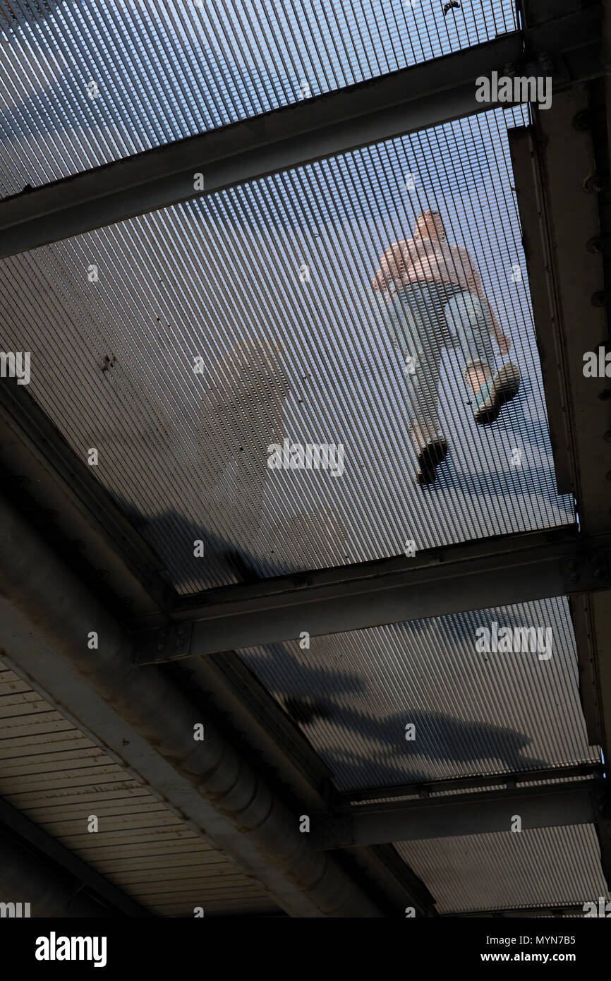 People through floor grating, Millennium Bridge, London, England, UK ...