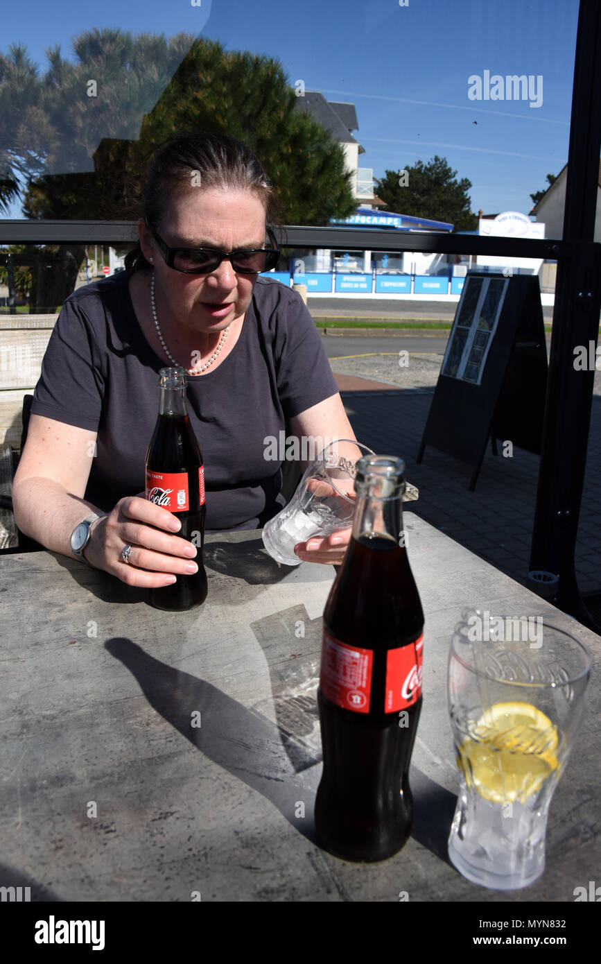 Woman drinking a cola at the cafe, France, Europe Stock Photo - Alamy