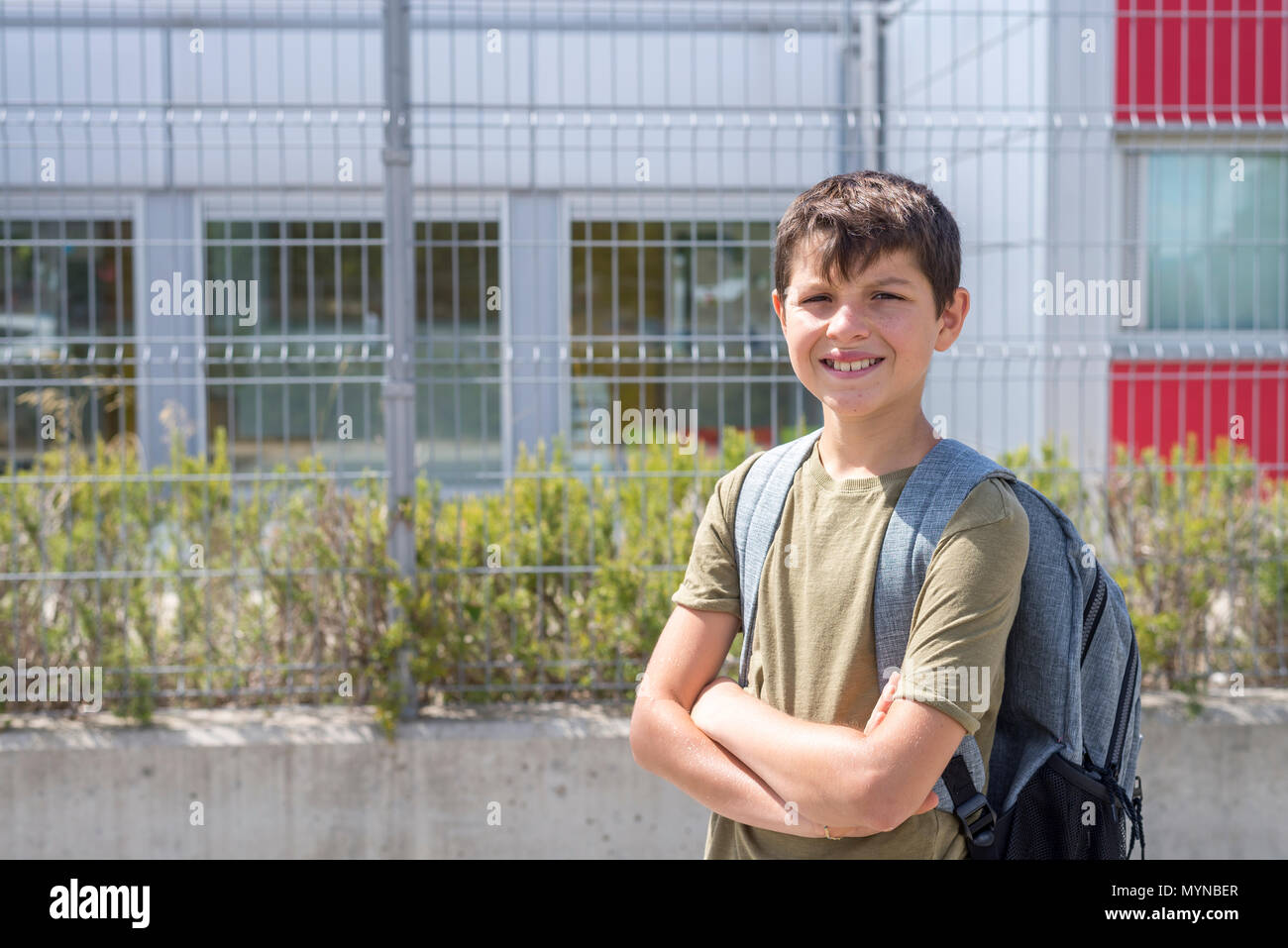 Cheerful child carrying his backpack Stock Photo - Alamy
