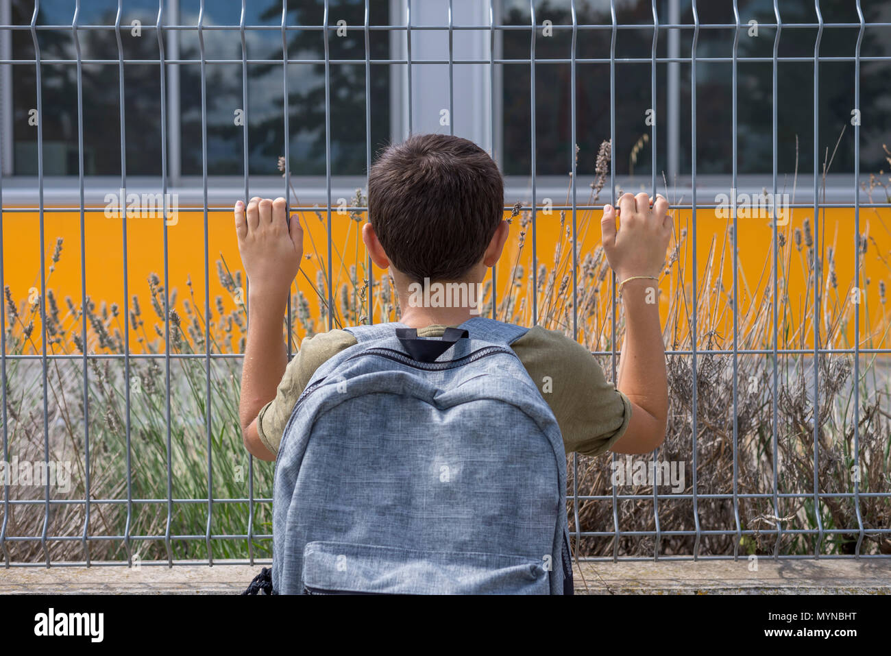 Cheerful child carrying his backpack Stock Photo - Alamy