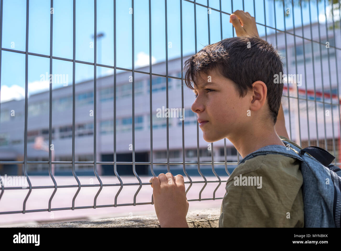 Cheerful child carrying his backpack Stock Photo - Alamy