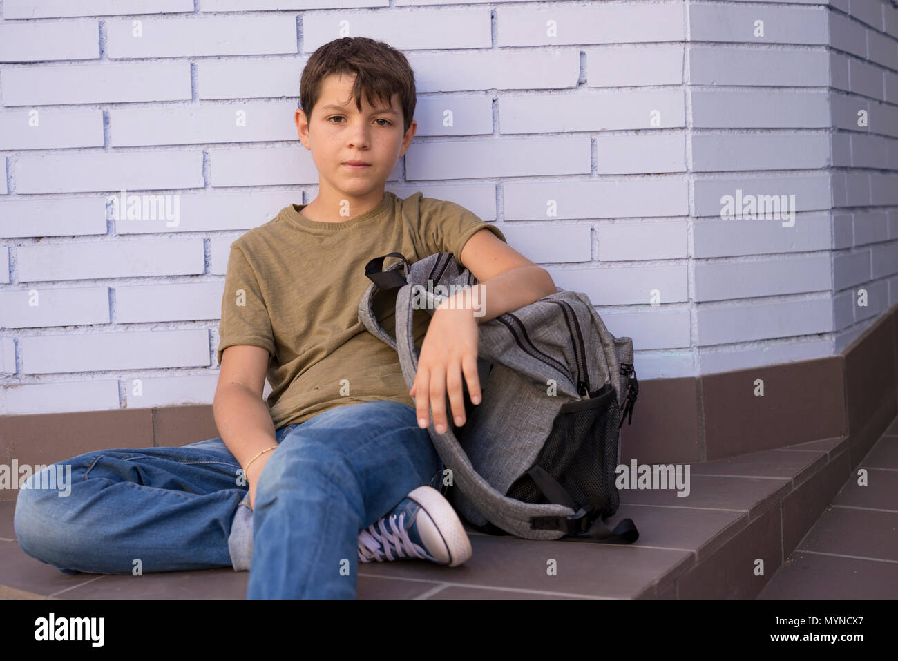 Cheerful child carrying his backpack ( back to school concept Stock ...