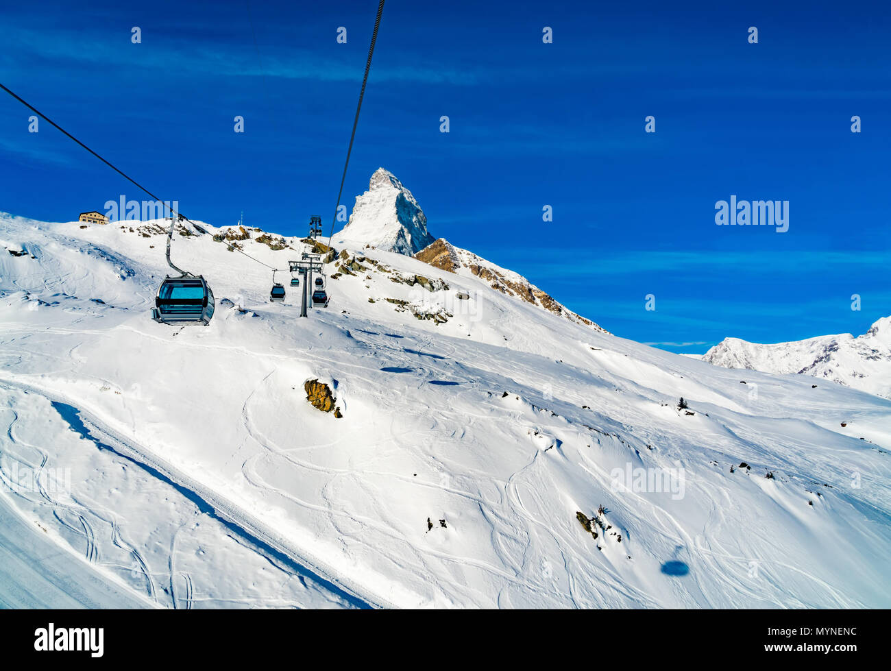View of cable cars to the snow covered Klein Matterhorn Peak Station at ...